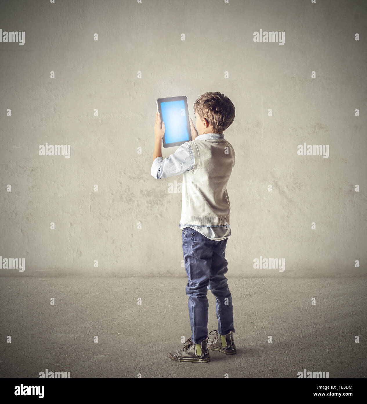 Young boy with tablet Stock Photo - Alamy