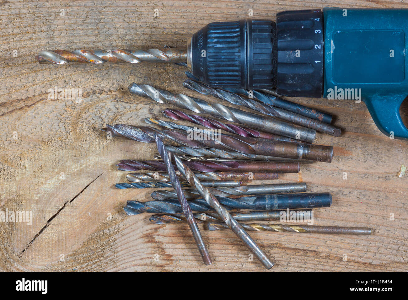 Different tools on a wooden background. drill, Wood drill, concrete ...