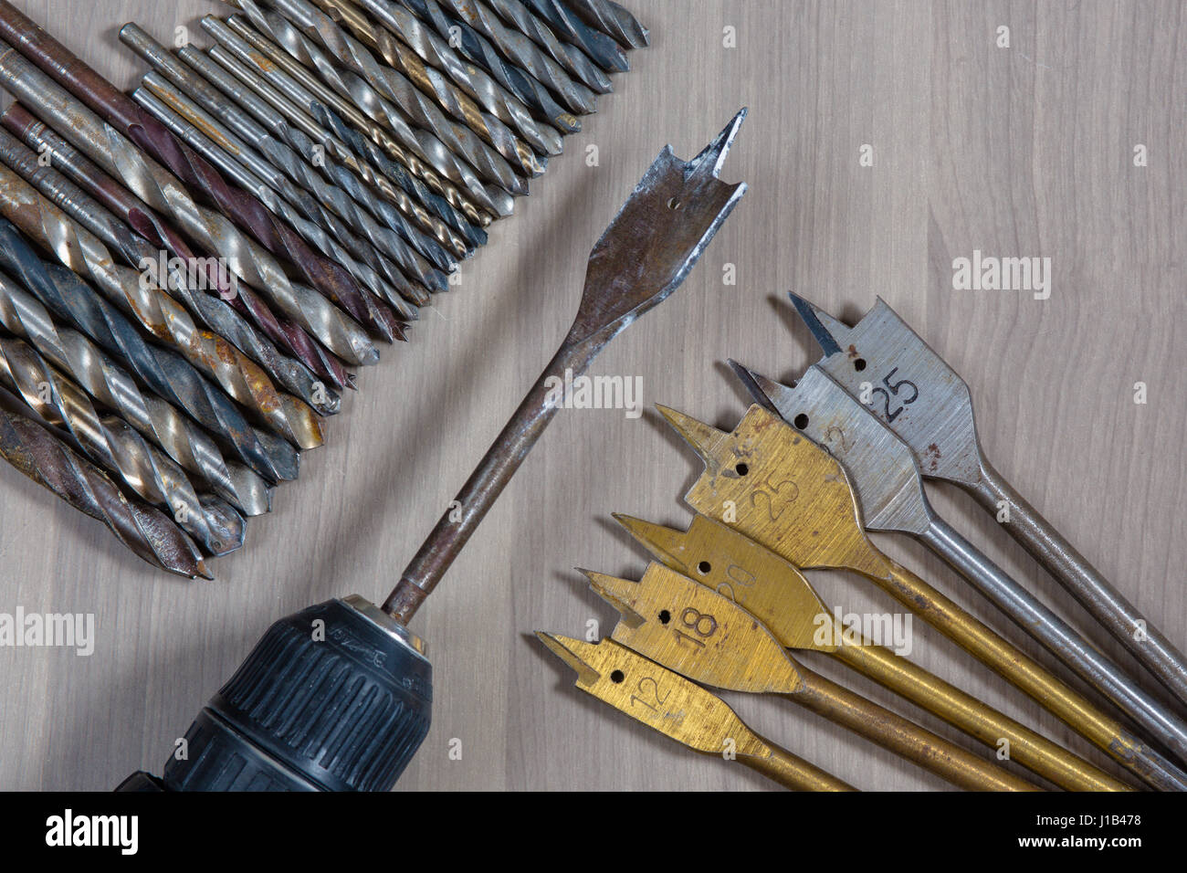 Different tools on a wooden background. drill, Wood drill, concrete ...