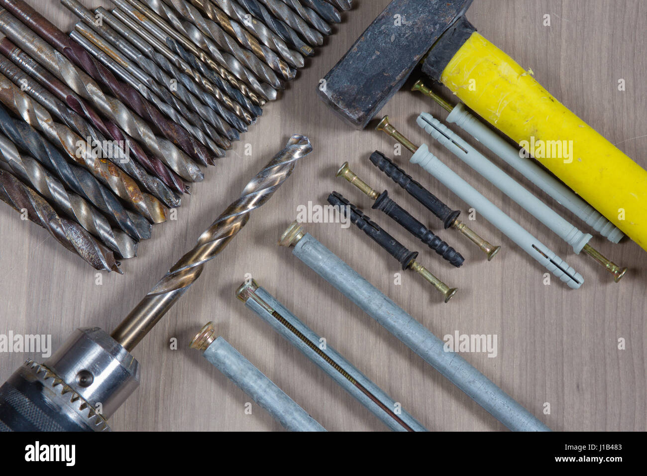 Different tools on a wooden background. drill, Wood drill, concrete ...