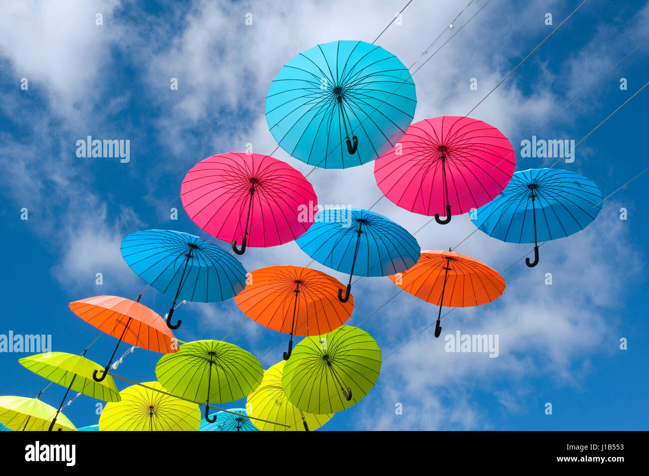 Rows of colourful umbrellas suspended over court yard in Toronto ...