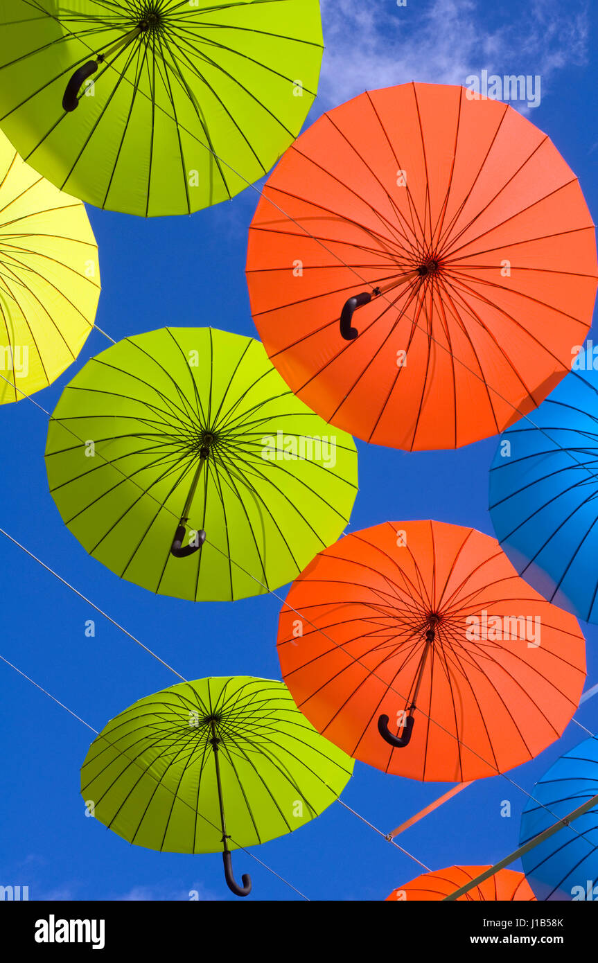 Rows of colourful umbrellas suspended over court yard in Toronto ...