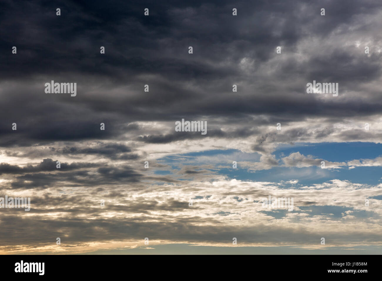 Dramatic light sunset top clouds hi-res stock photography and images ...