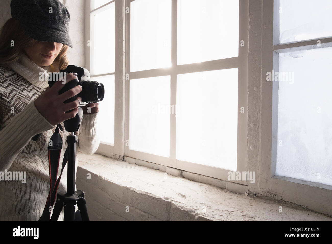 Woman near window hi-res stock photography and images - Alamy