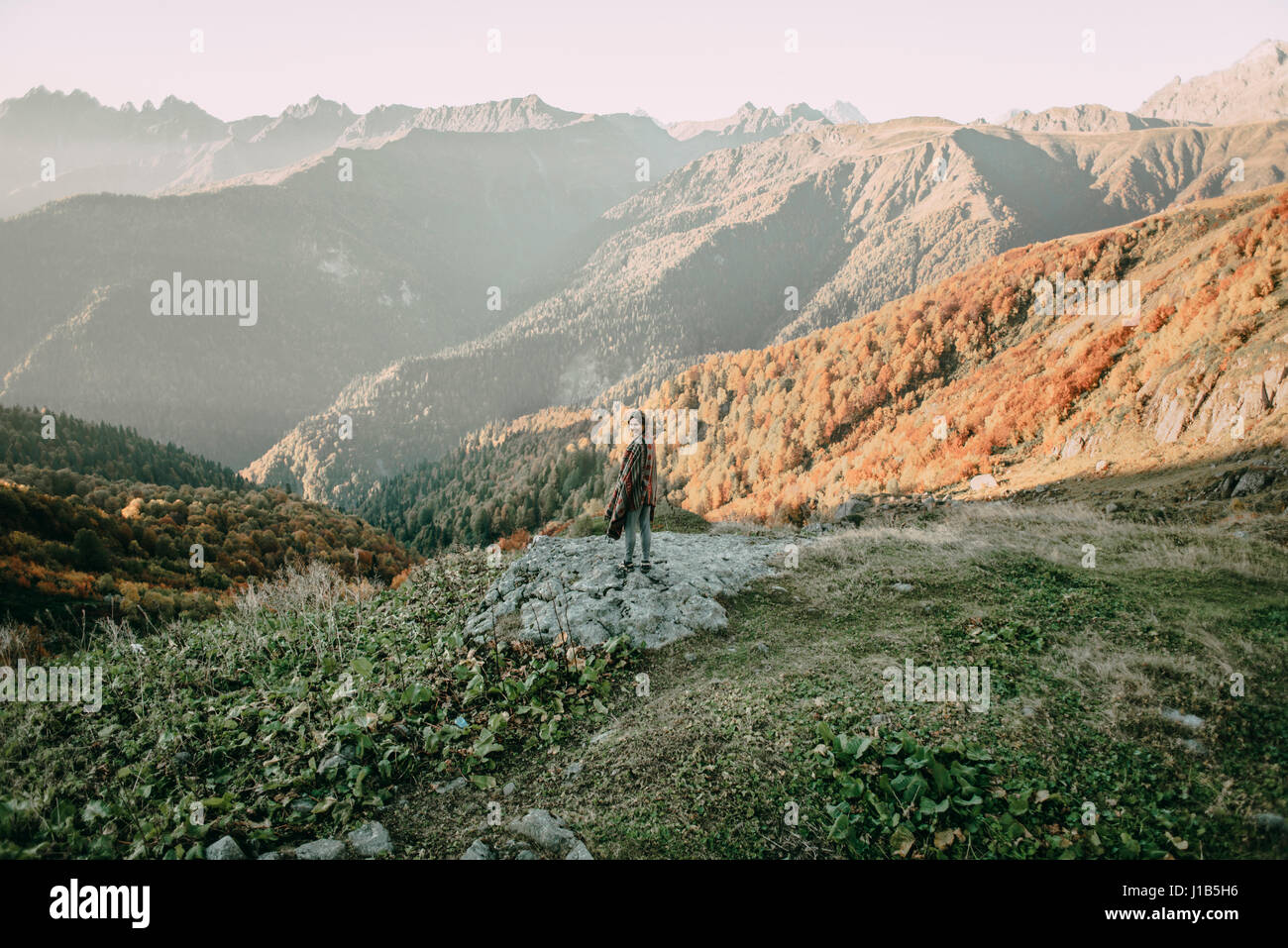 Woman on mountain valley hi-res stock photography and images - Alamy