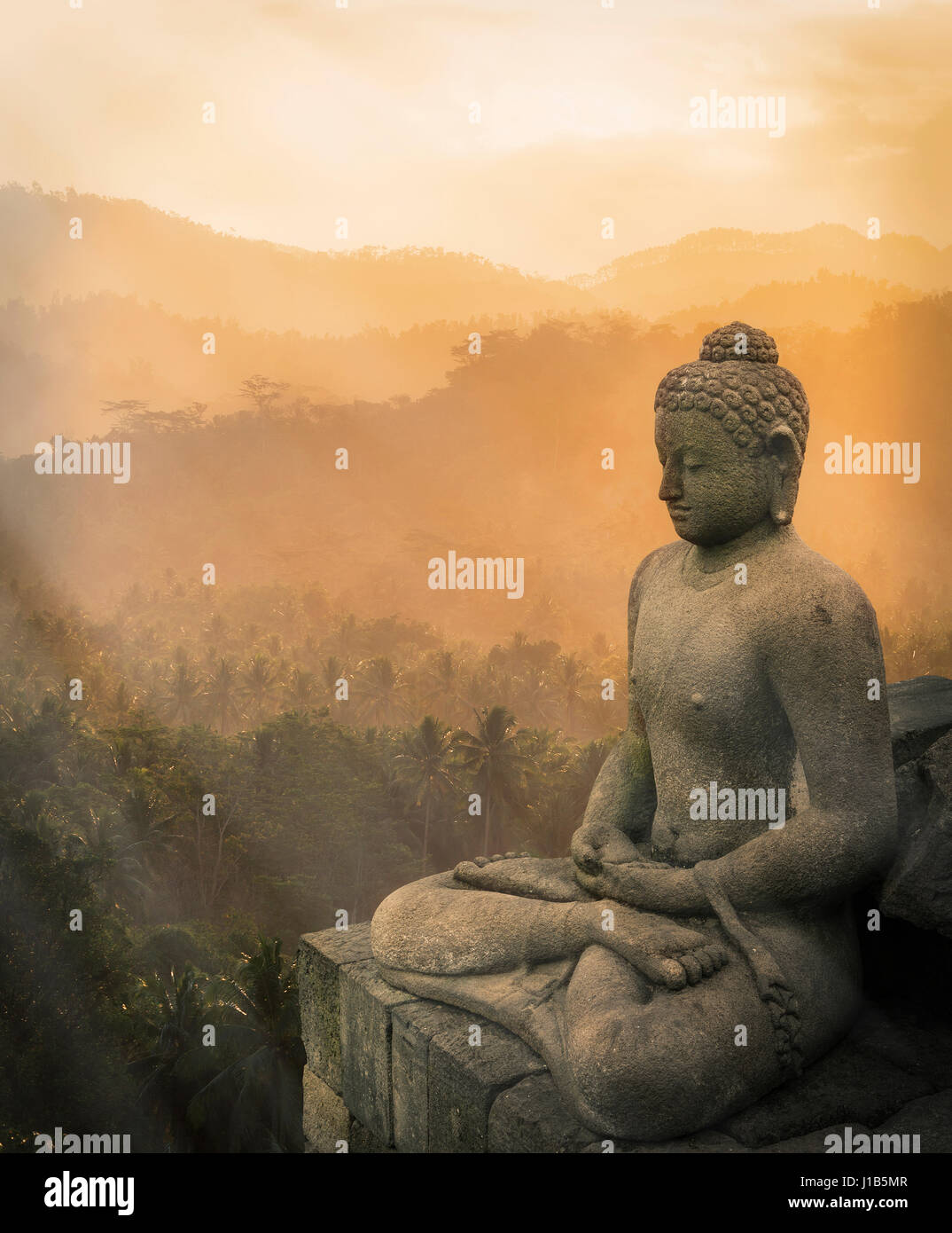 Statue of Buddha at sunset, Borobudur, Java, Indonesia Stock Photo - Alamy
