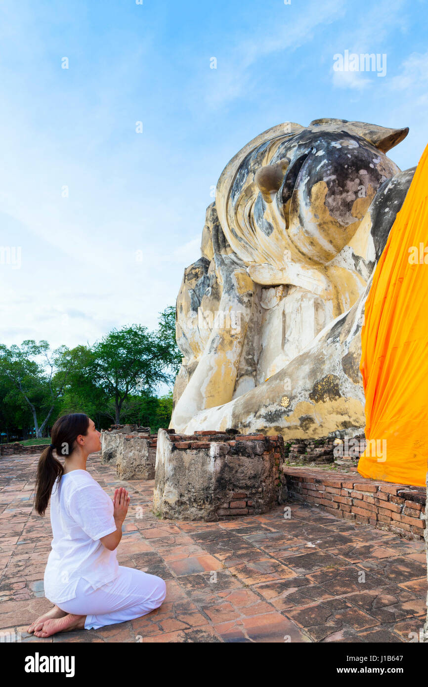 Woman praying at temple hi-res stock photography and images - Alamy