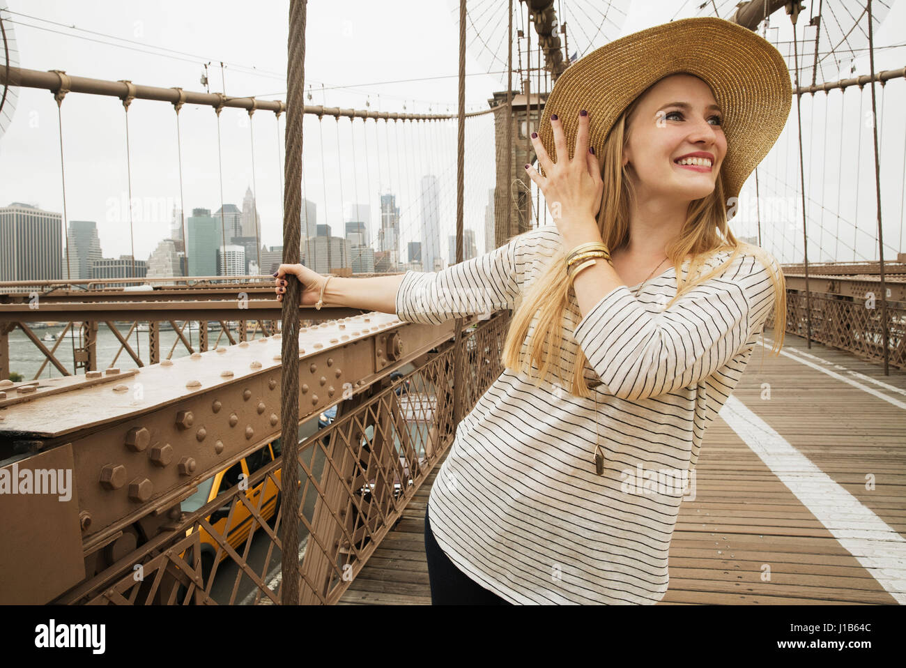 Portrait of smiling Caucasian woman on bridge Stock Photo - Alamy