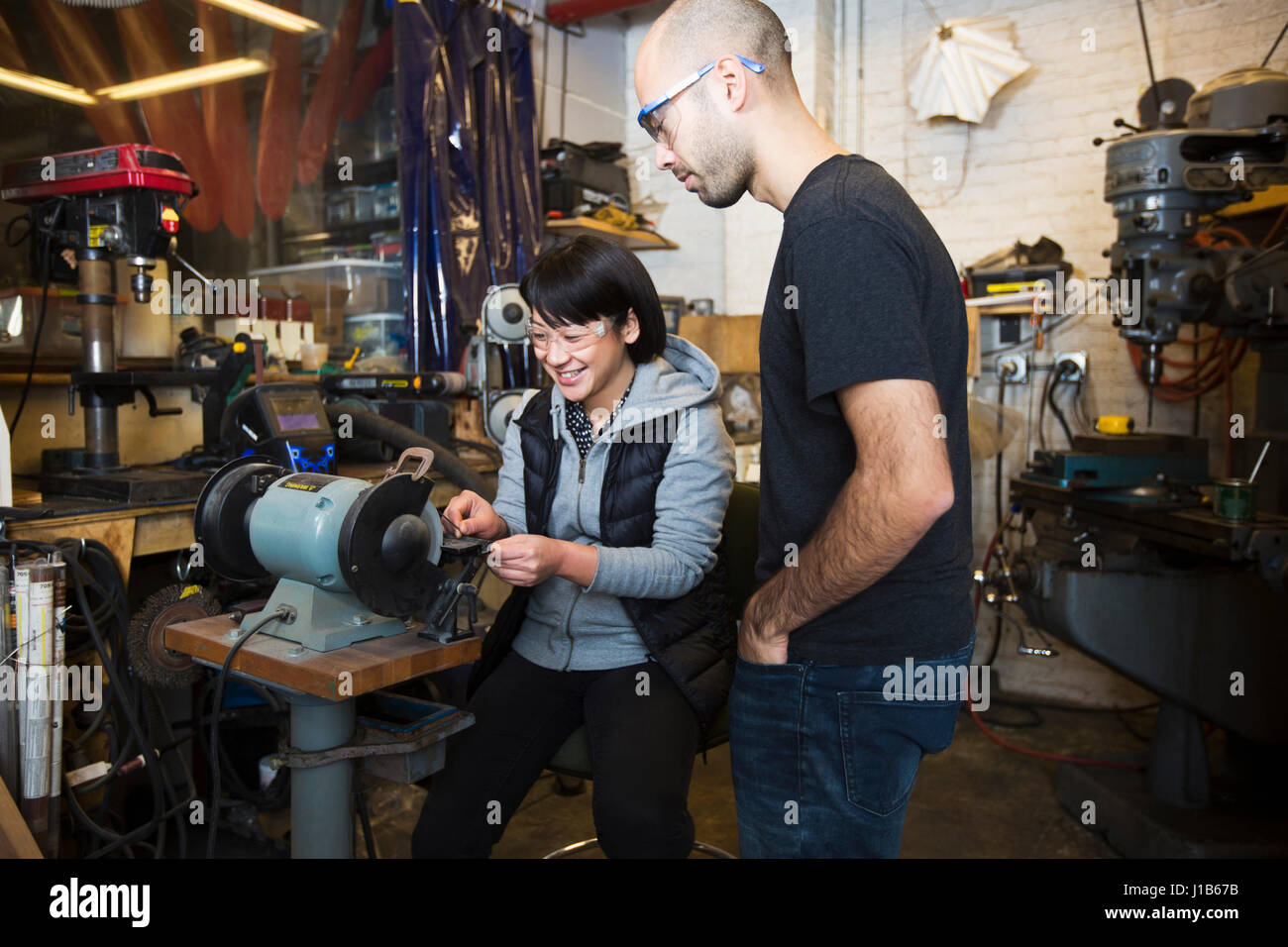 Woman using angle grinder hi-res stock photography and images - Alamy