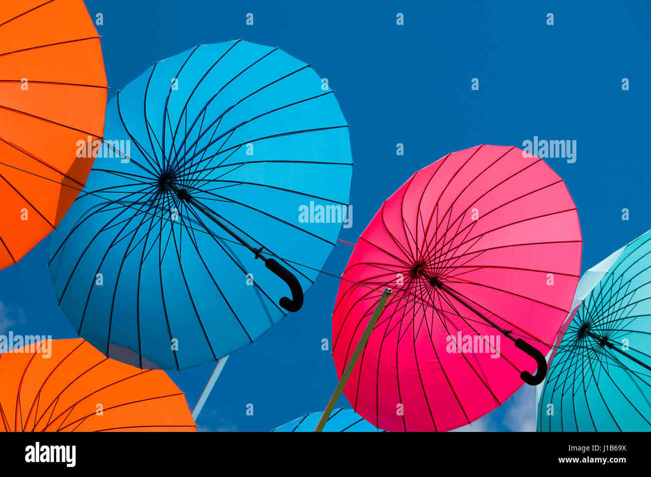 Rows of colourful umbrellas suspended over court yard in Toronto ...