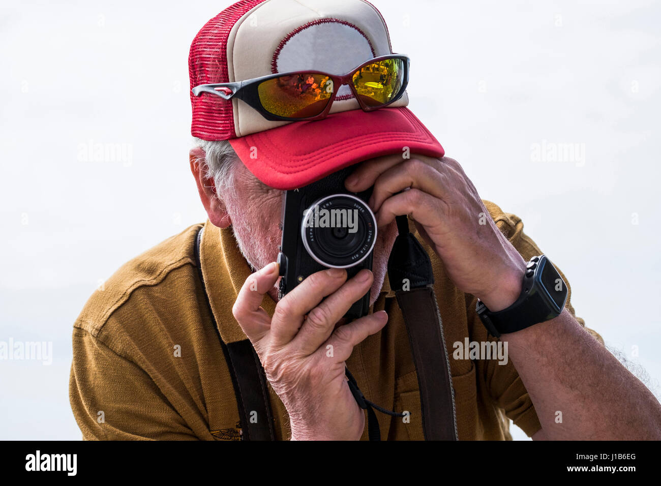 Caucasian man photographing with camera Stock Photo - Alamy