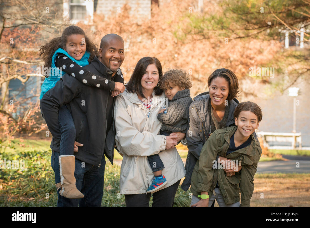 Portrait of smiling multi-ethnic family Stock Photo - Alamy