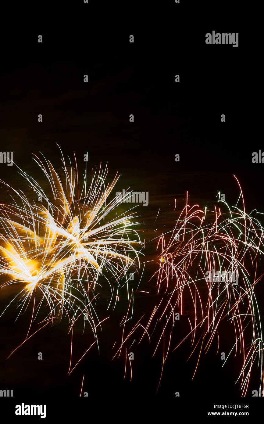 White and yellow fireworks in the night sky, La Ronde, Montreal, Quebec ...