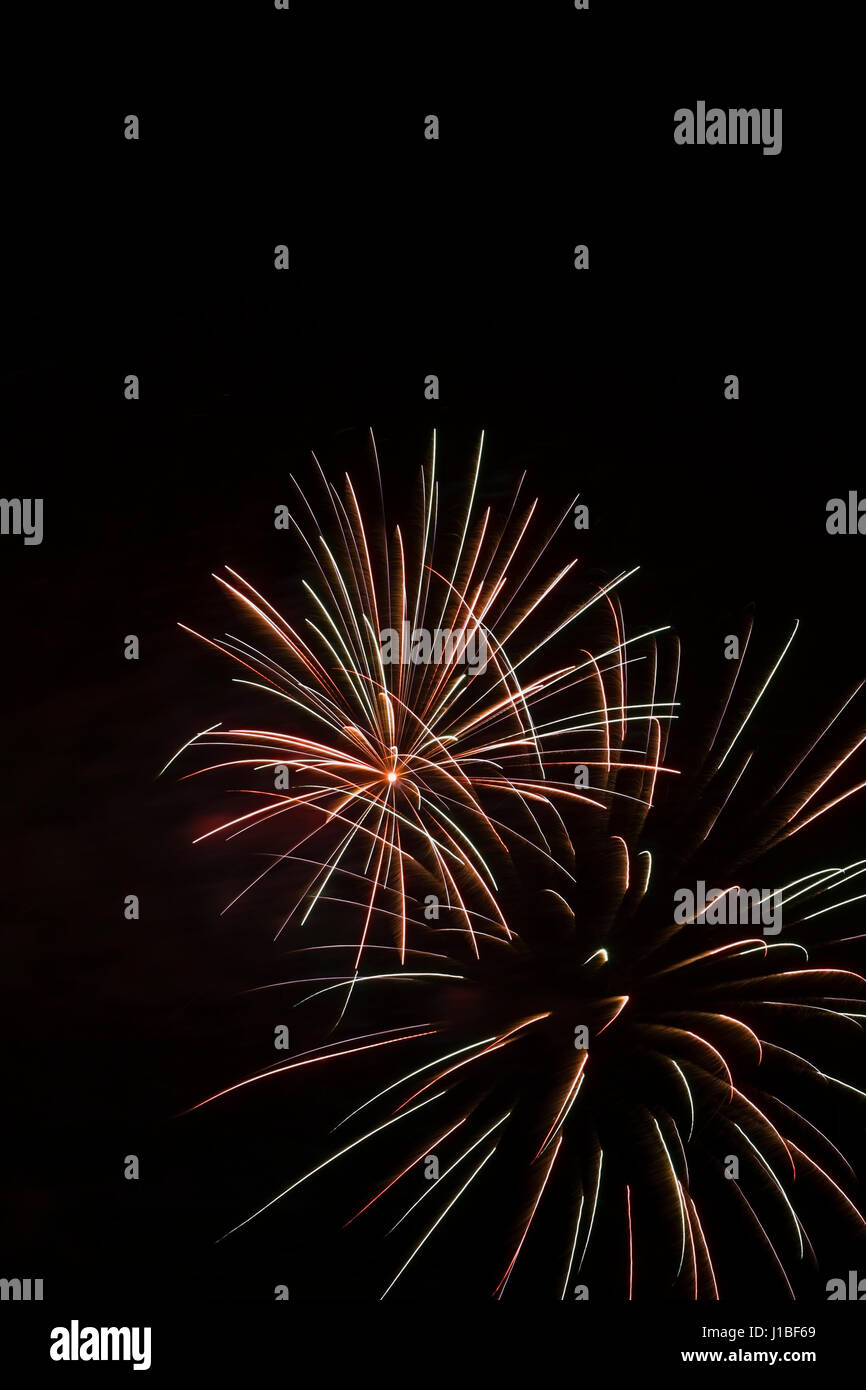 Red, gold and green fireworks in the night sky, La Ronde, Montreal ...
