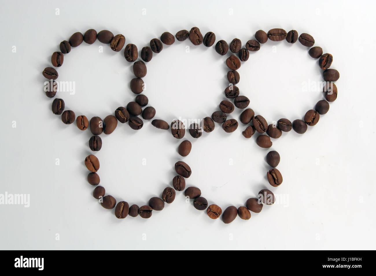 Olympic circles shaped coffee beans. Olympics in Rio Stock Photo - Alamy