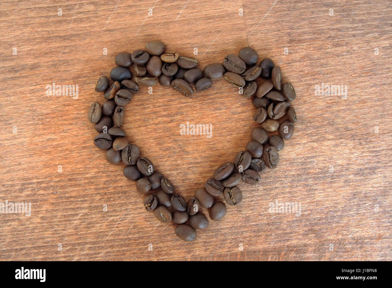 Heart shaped coffee beans. Roasted coffee beans Stock Photo - Alamy