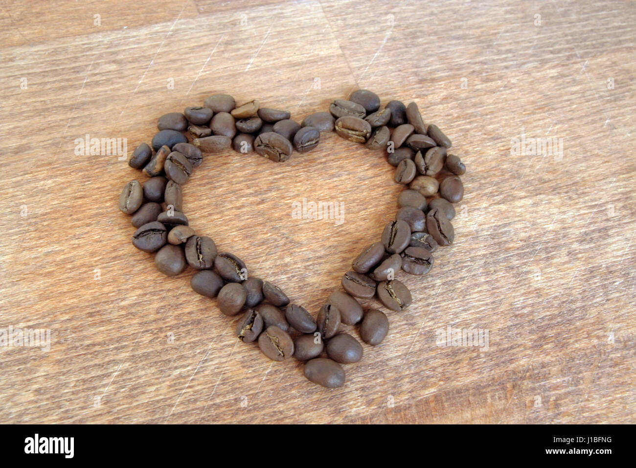 Heart shaped coffee beans. Roasted coffee beans Stock Photo - Alamy