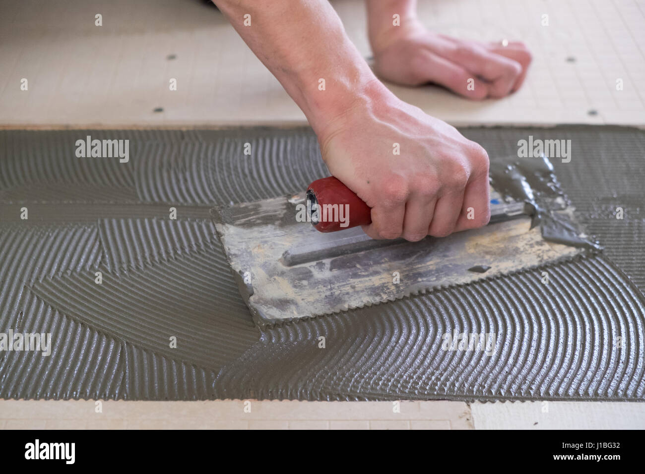 Tile setter hi-res stock photography and images - Alamy