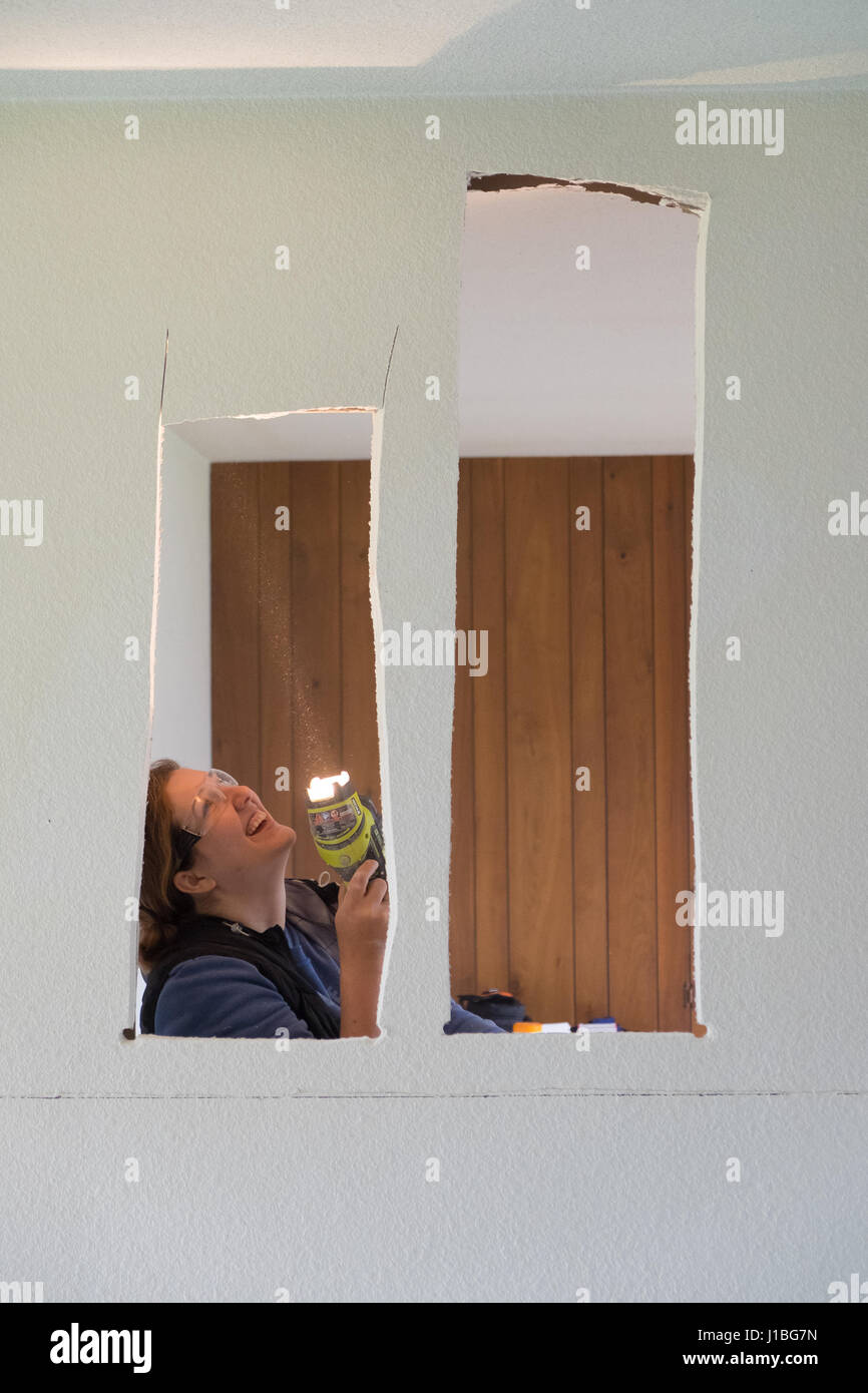 SPRINGFIELD, OR - DECEMBER 20, 2017: Female construction worker and ...