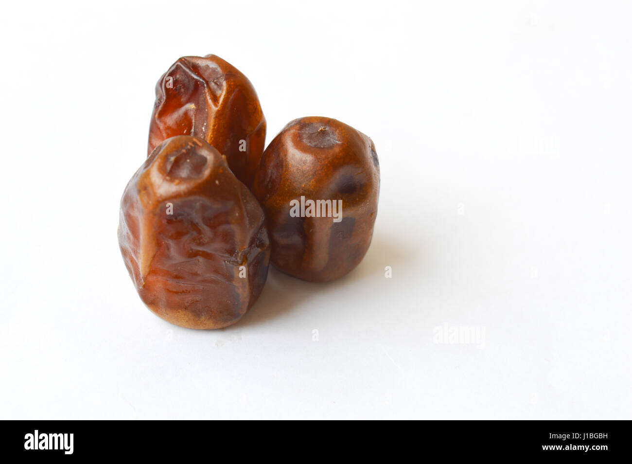 group of dates isolated on white Stock Photo - Alamy