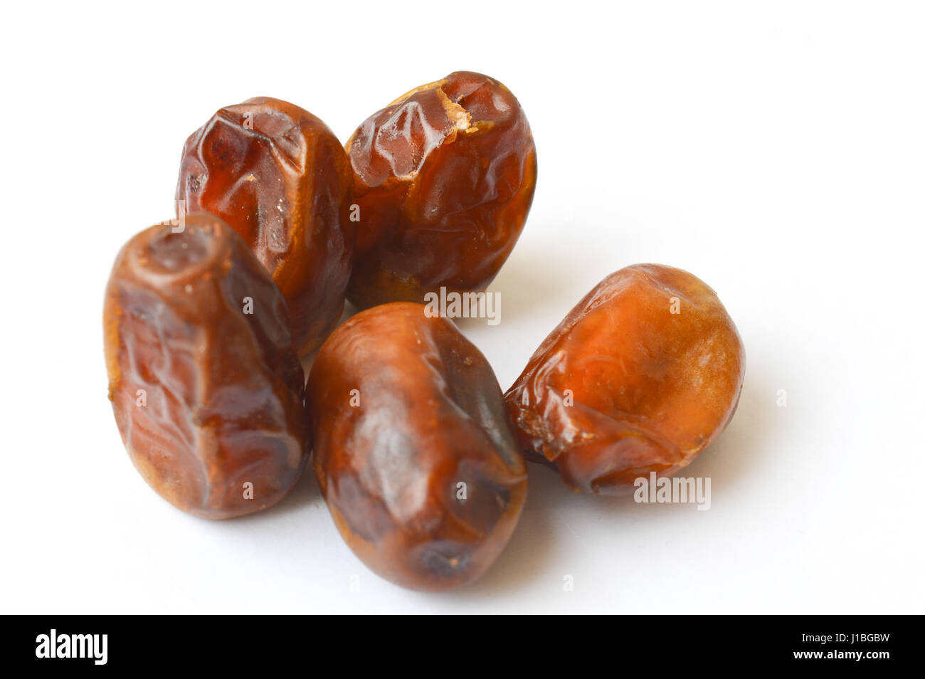 group of dates isolated on white Stock Photo - Alamy