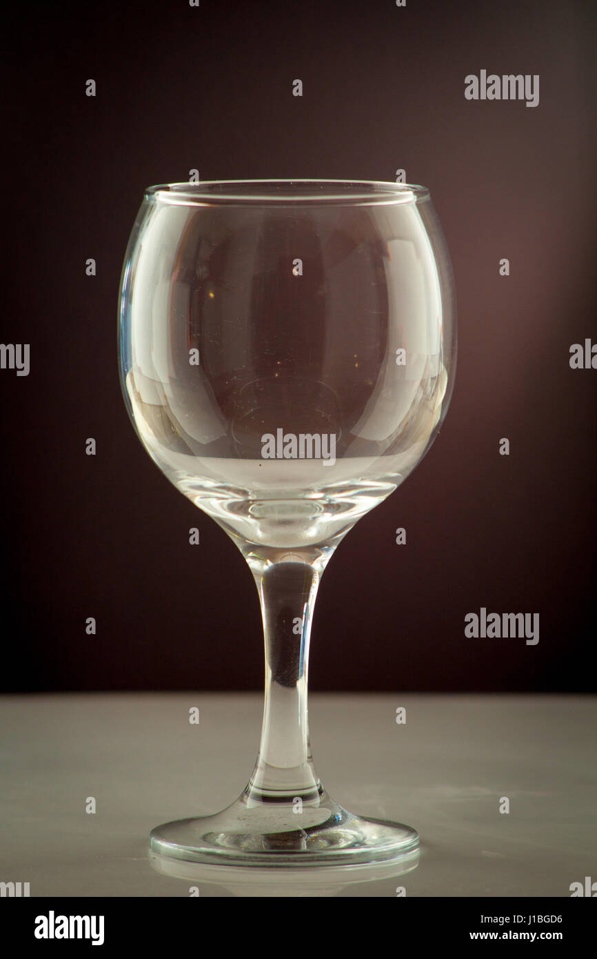 Clean drinking water from a source pouring into a clear glass beaker in ...