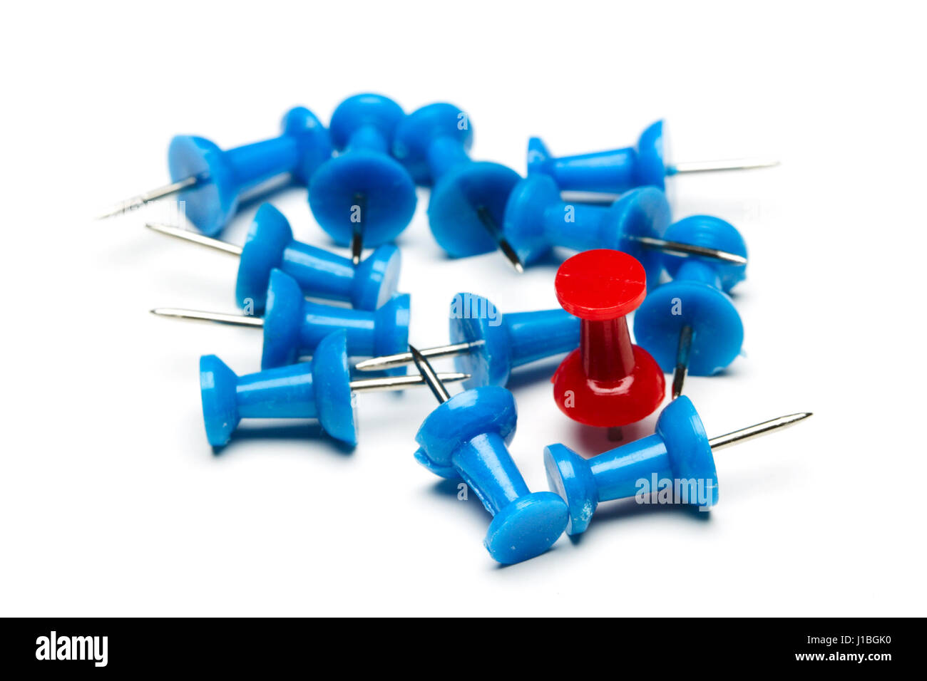 A red push pin among blue push pins (concept of winning Stock Photo - Alamy