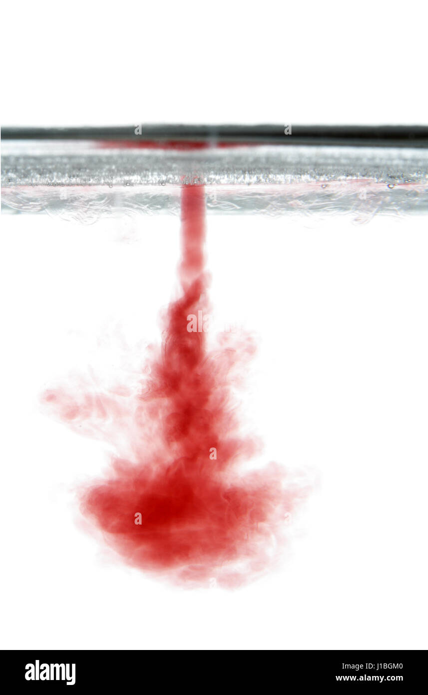 A red color liquid abstract injected into water Stock Photo - Alamy