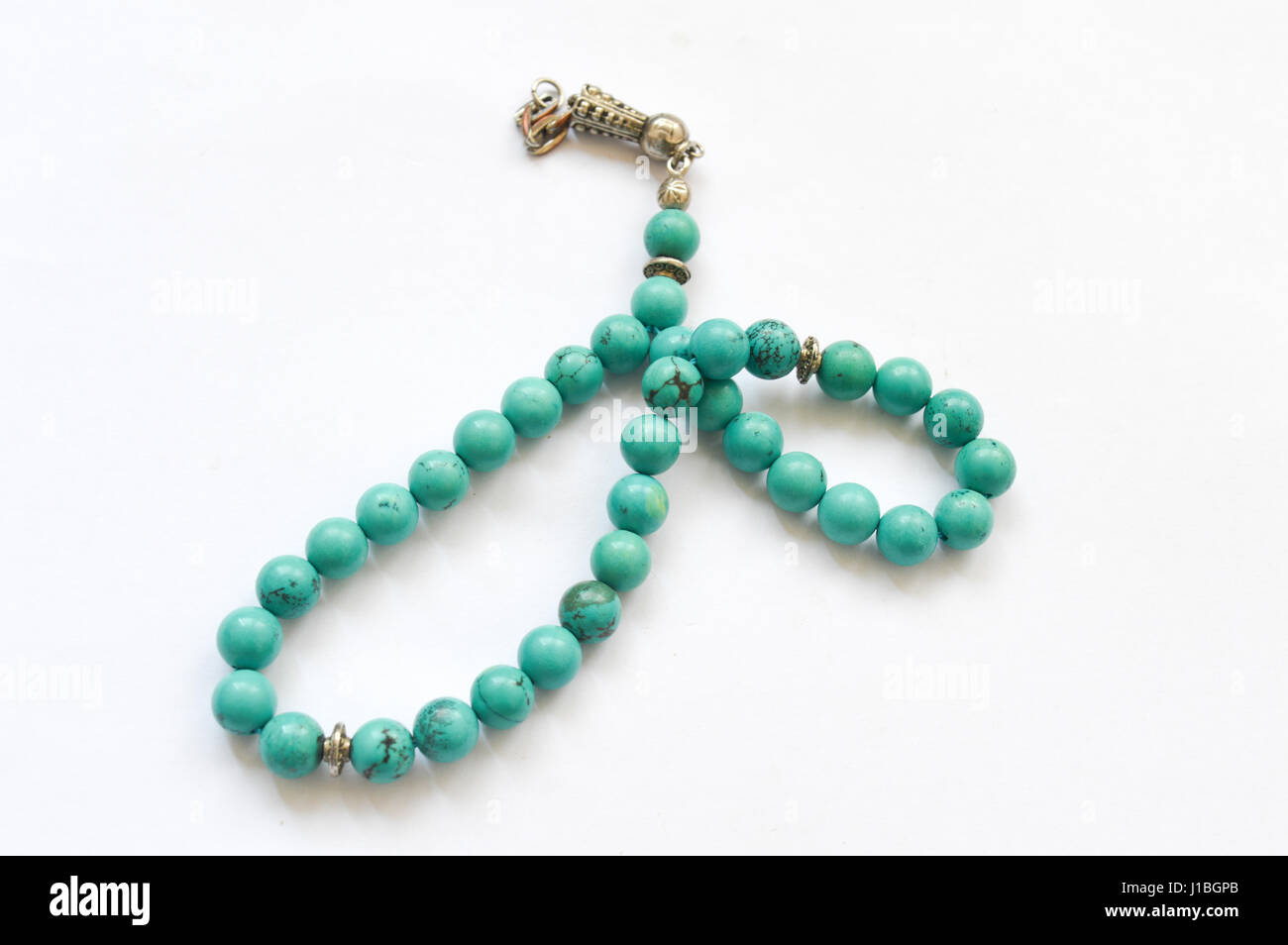 blue beads isolated on white Stock Photo - Alamy