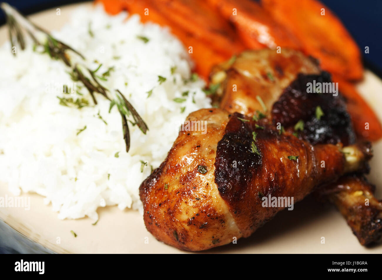 Barbecue chicken meal with rice and carrots Stock Photo - Alamy