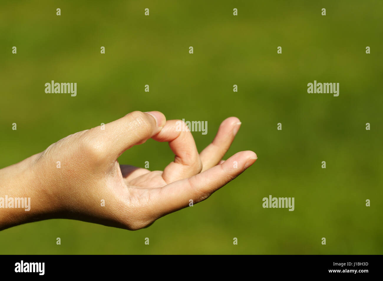 A hand with fingers ini meditation/yoga position Stock Photo - Alamy