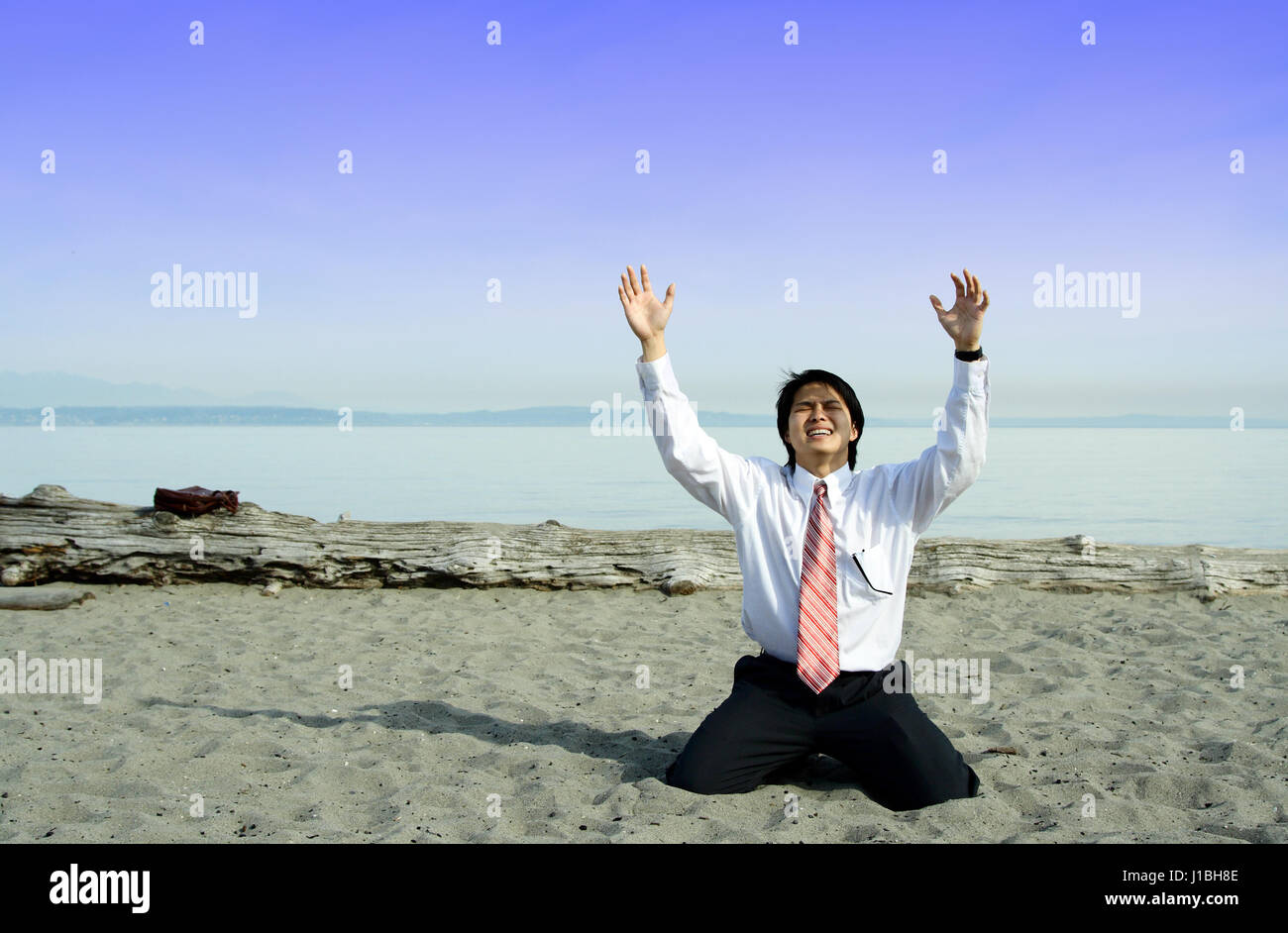A stressed and frustrated businessman on the beach Stock Photo - Alamy