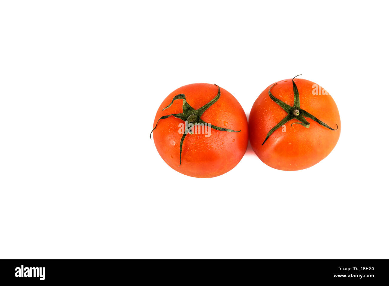 Two Red Tomatoes isolated on White Background Stock Photo - Alamy