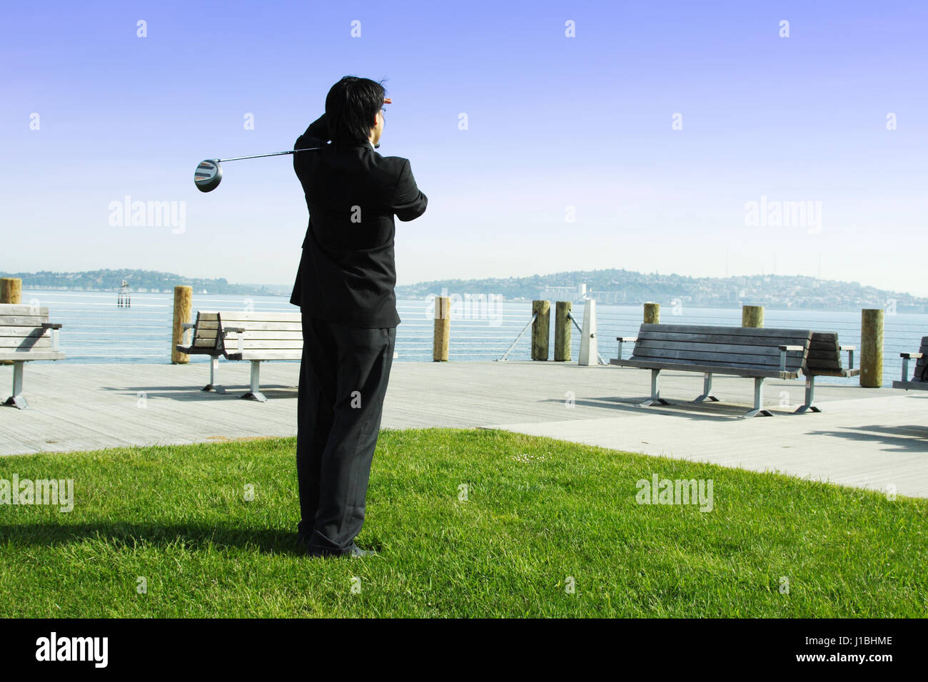 Business executive playing golf hi-res stock photography and images - Alamy