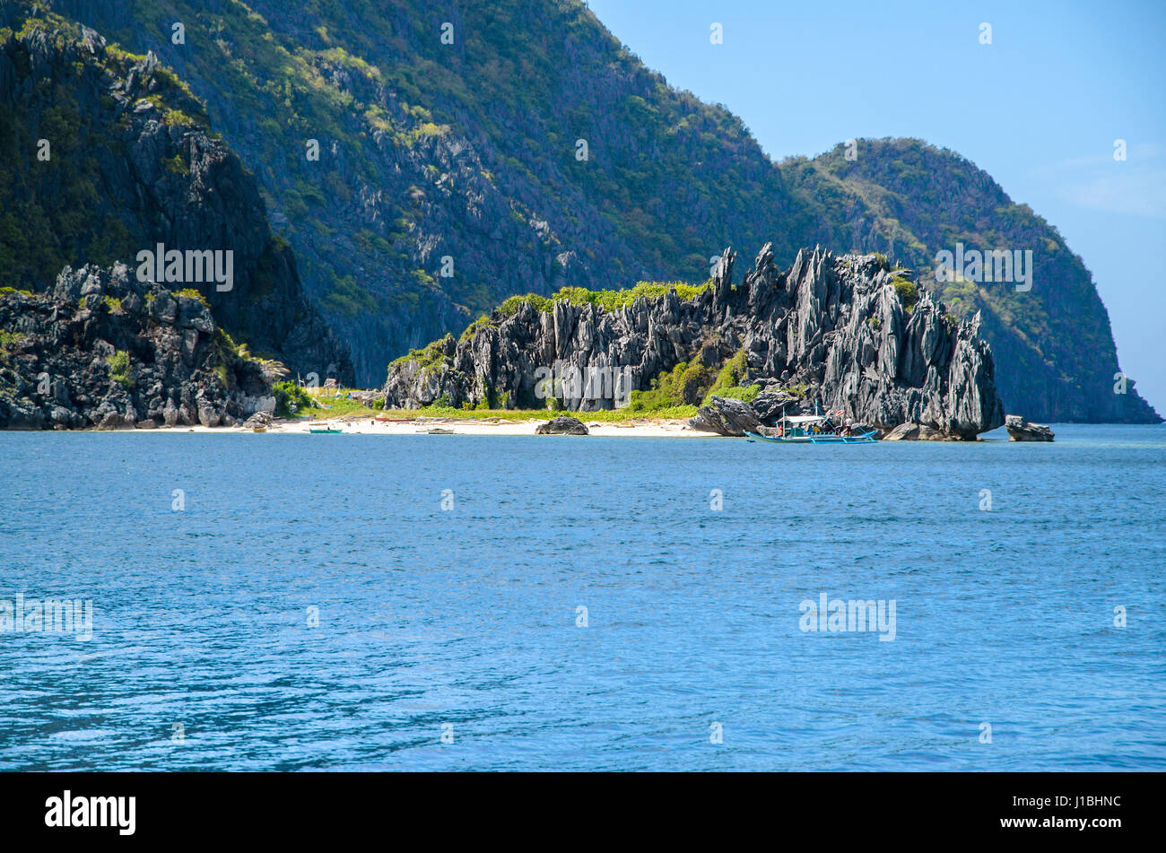 El Nido, Philippines - rocks in front of Matinloc island Stock Photo ...