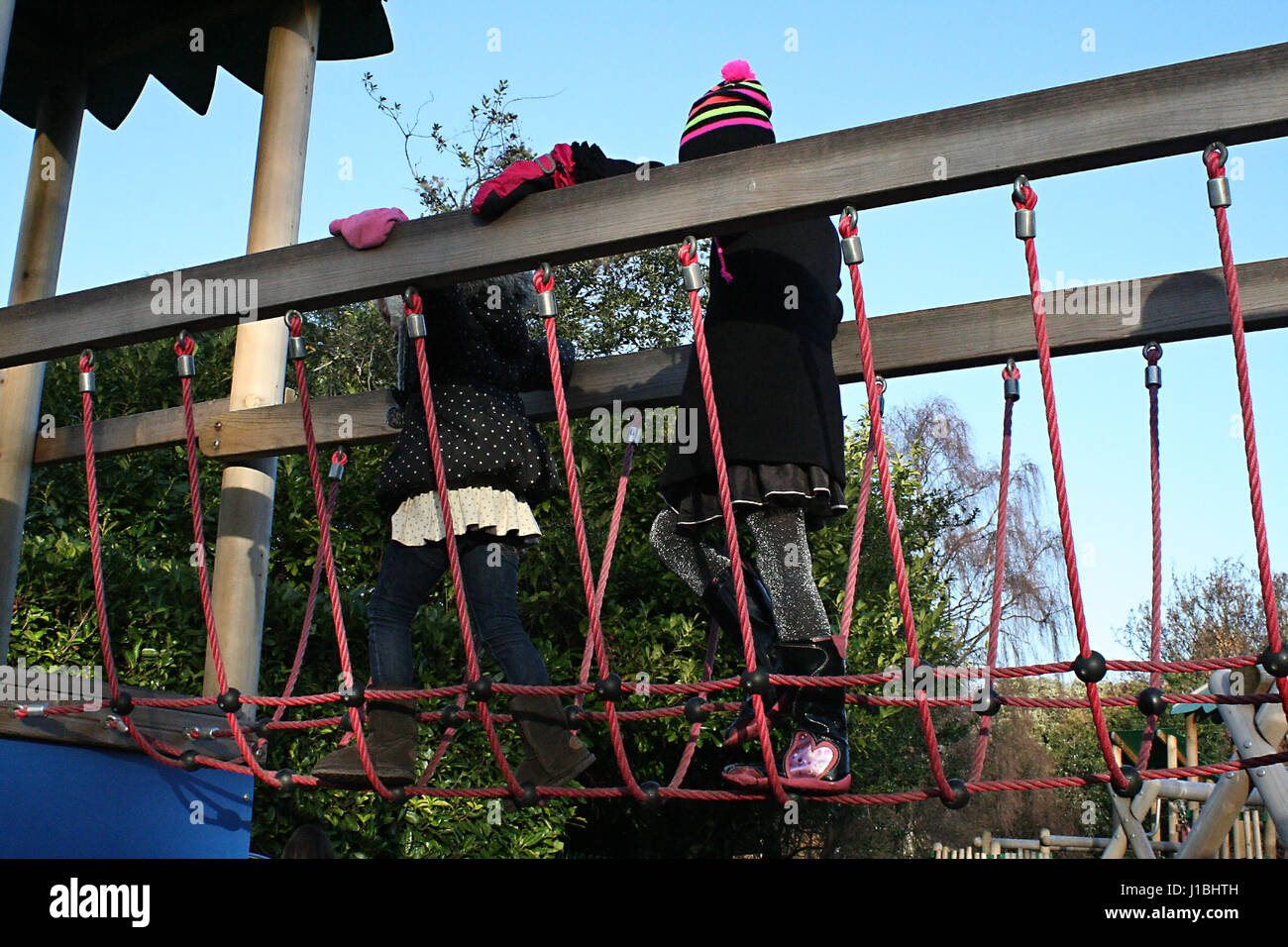 Children walking and playing on the ropes in the playground in St ...