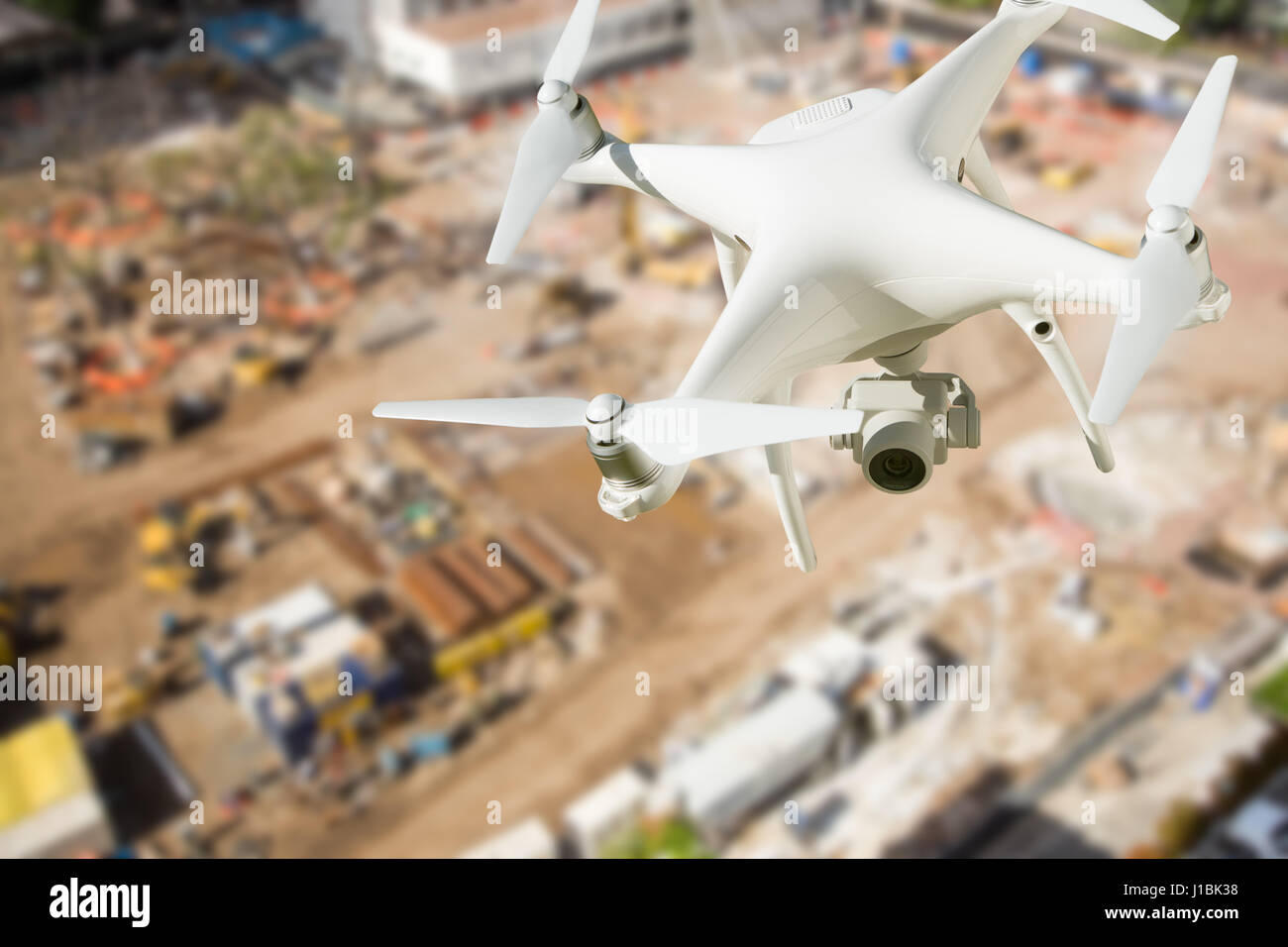 Unmanned Aircraft System (UAV) Quadcopter Drone In The Air Over ...