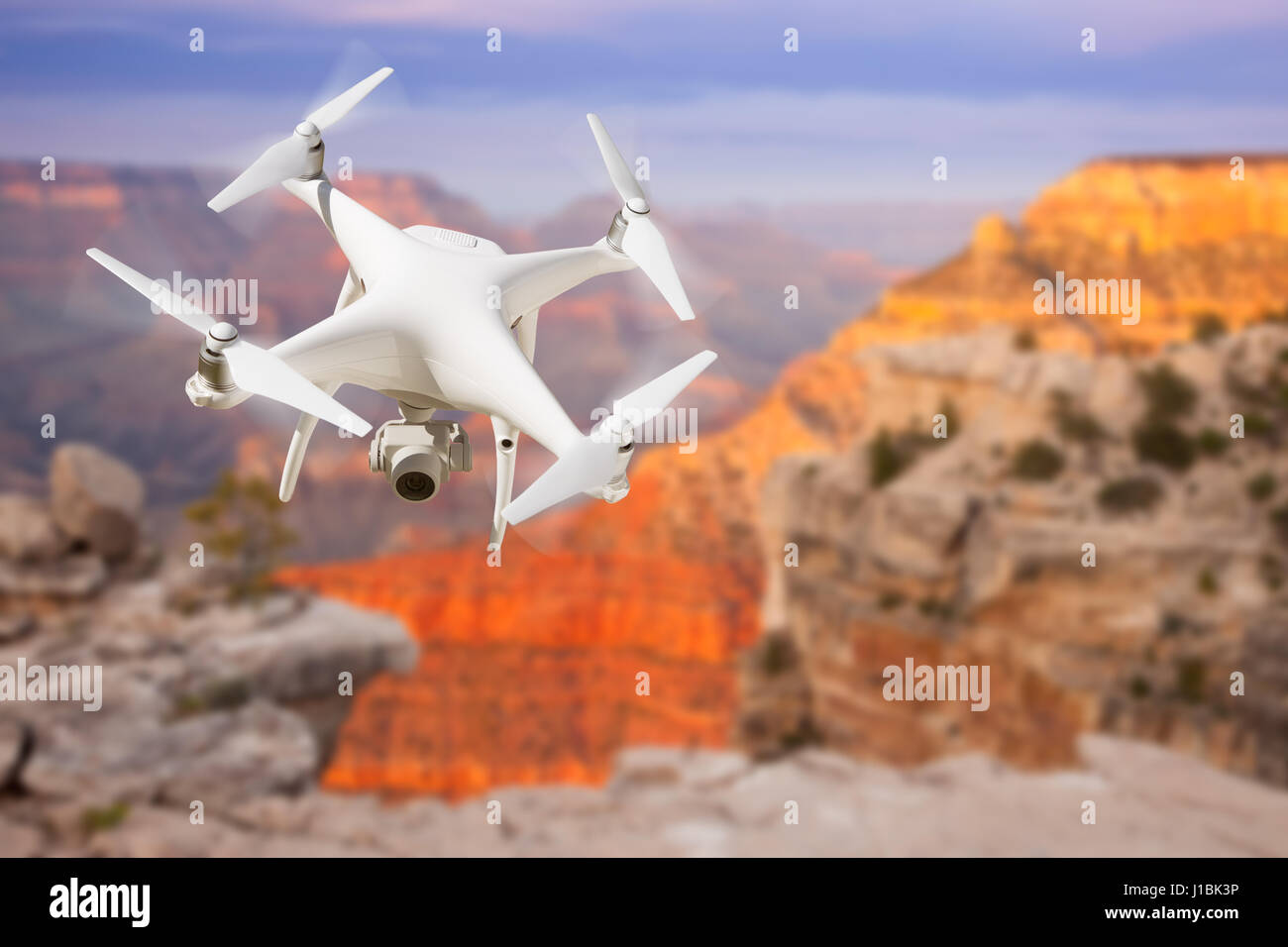 Unmanned Aircraft System (UAV) Quadcopter Drone In The Air Over The ...
