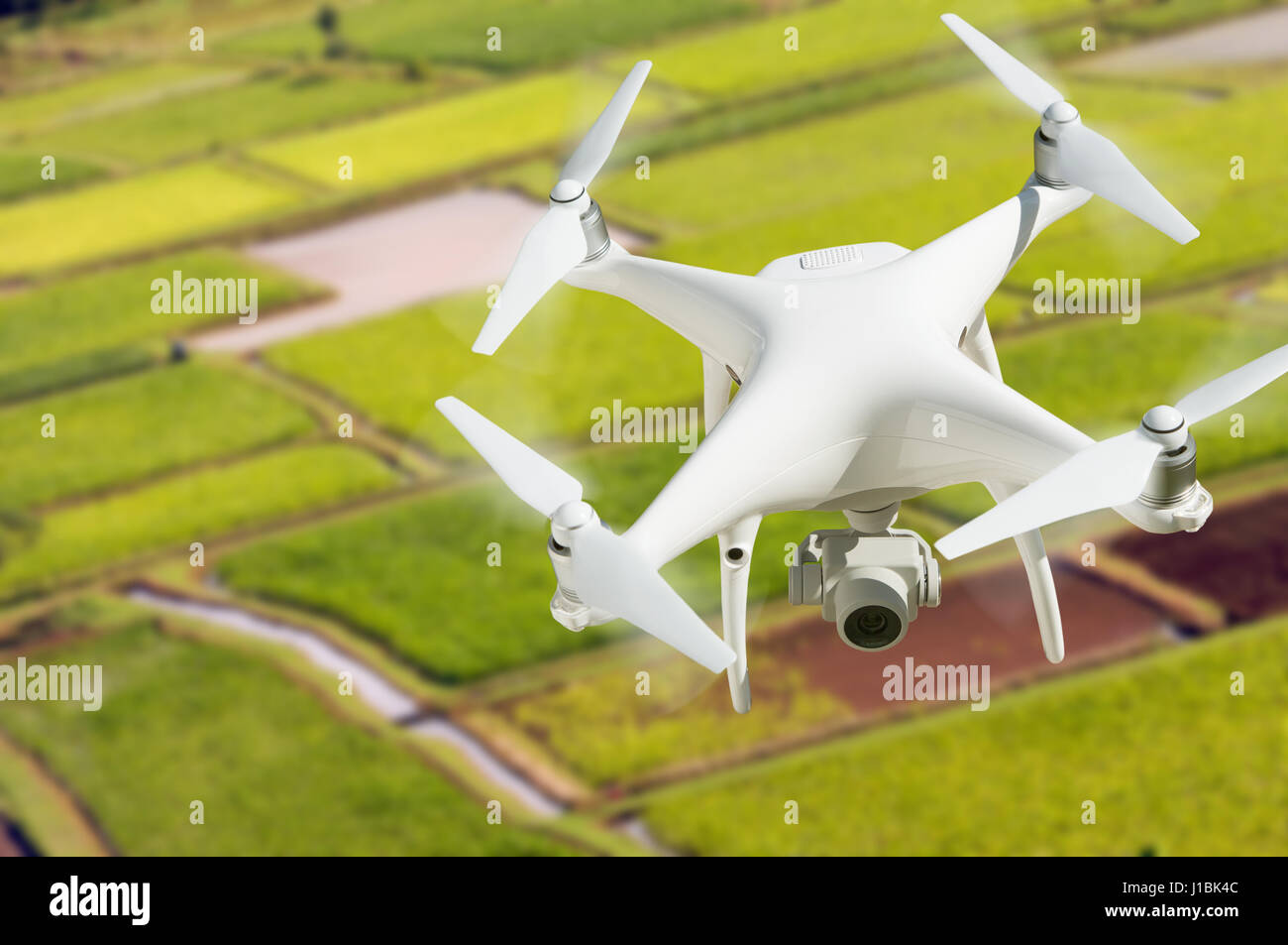 Unmanned Aircraft System (UAV) Quadcopter Drone In The Air Over Hanalei ...
