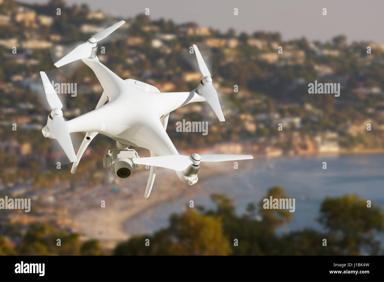 Unmanned Aircraft System (UAV) Quadcopter Drone In The Air Over The ...