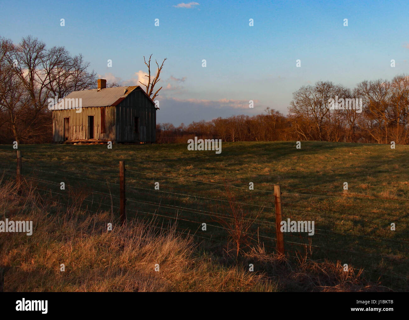 Barn in Field at Sunset Stock Photo - Alamy