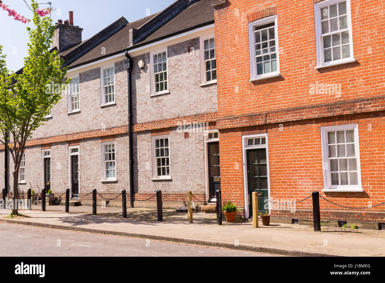 Classic British restored Edwardian brick houses on a local road with ...