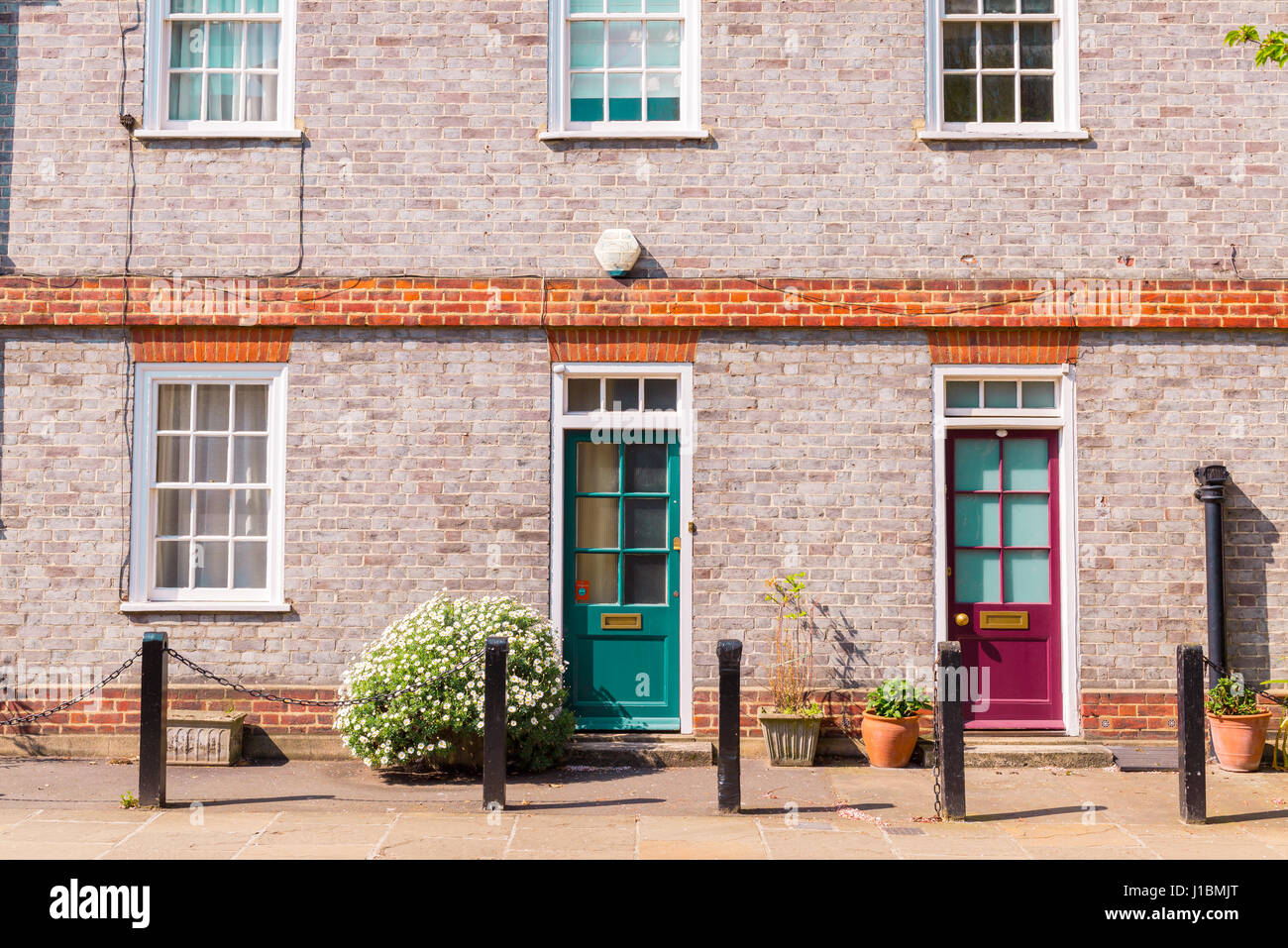 Front facade exterior of classic British restored Victorian brick house ...