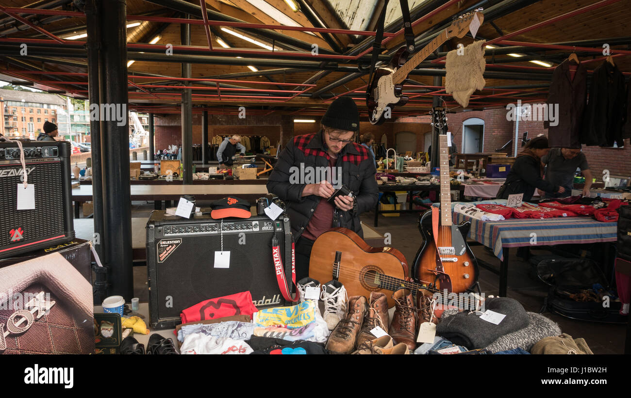Market stall with vendor Stock Photo - Alamy