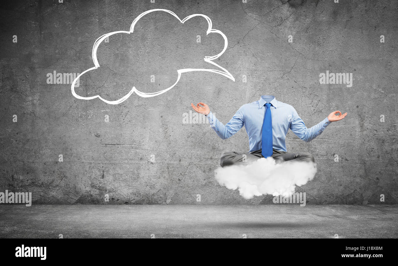 Headless businessman meditating Stock Photo - Alamy
