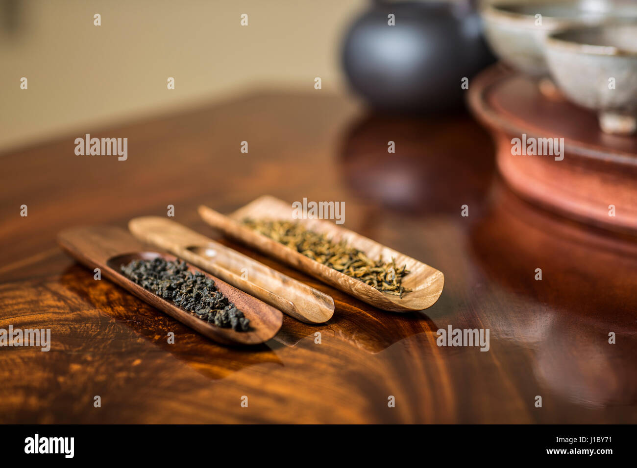 Tea in a wooden utensil used to pour into the tea pot Stock Photo - Alamy