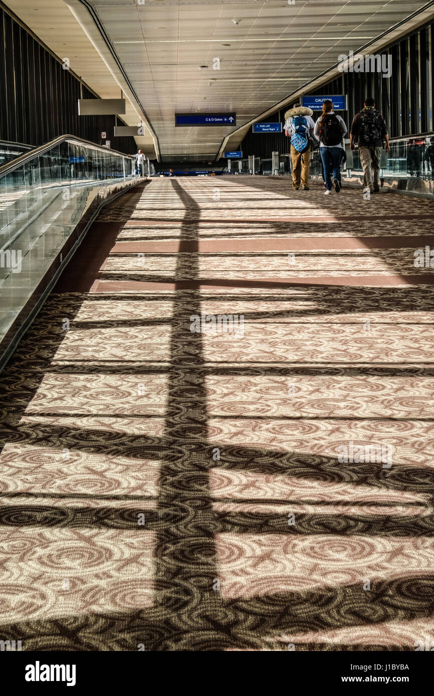 A Horizontal View of a Sun Lit International Airport Corridor with ...