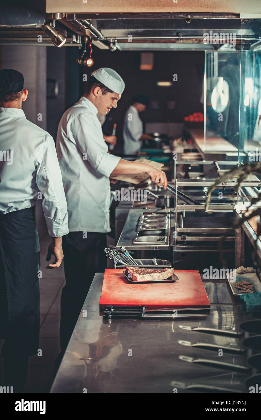 Preparing traditional beef steak Stock Photo - Alamy