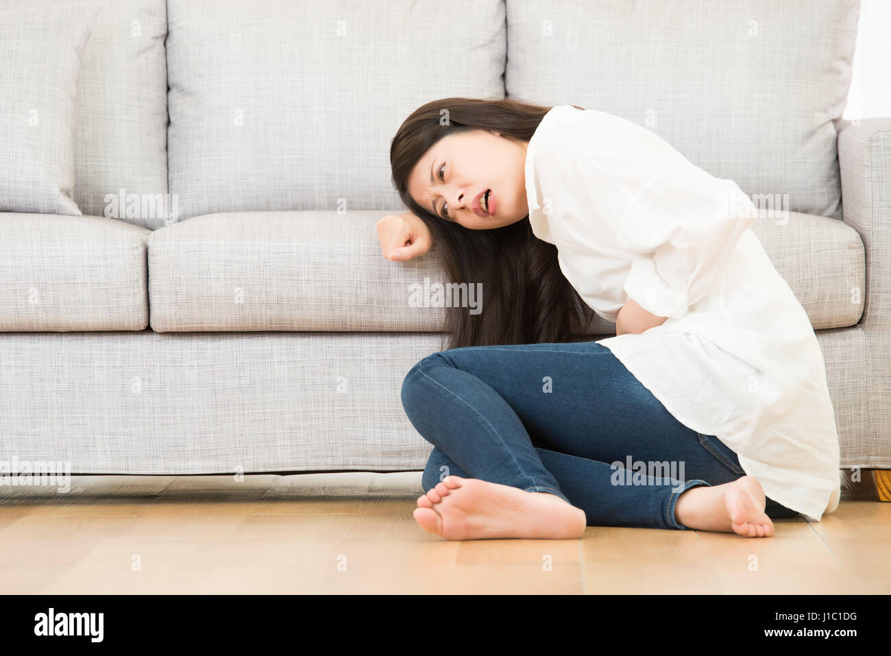 woman suffering sickness stomach ache pain period. lifestyle and health ...