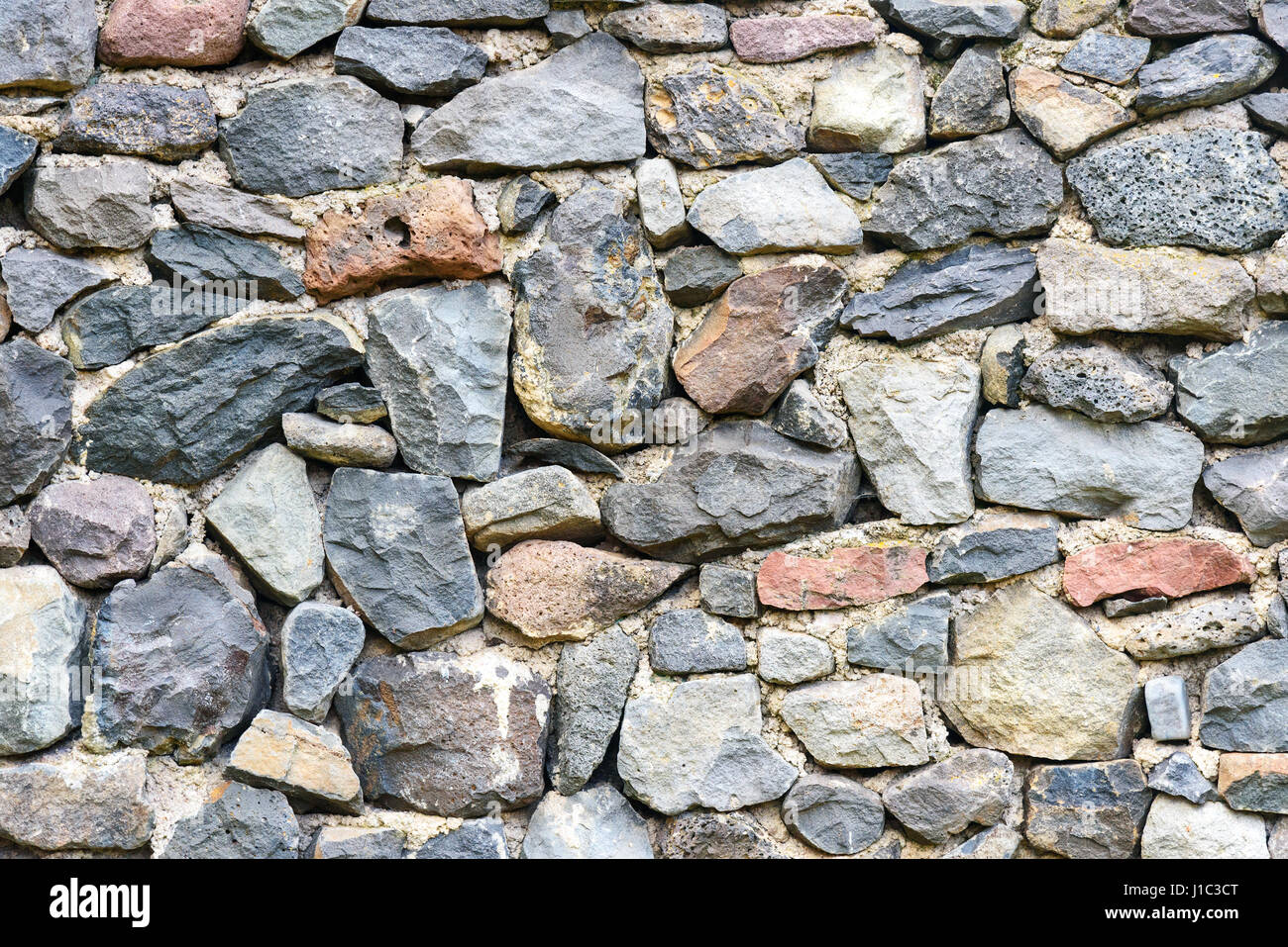 Old stacked stone wall of fortress. Background texture Stock Photo - Alamy